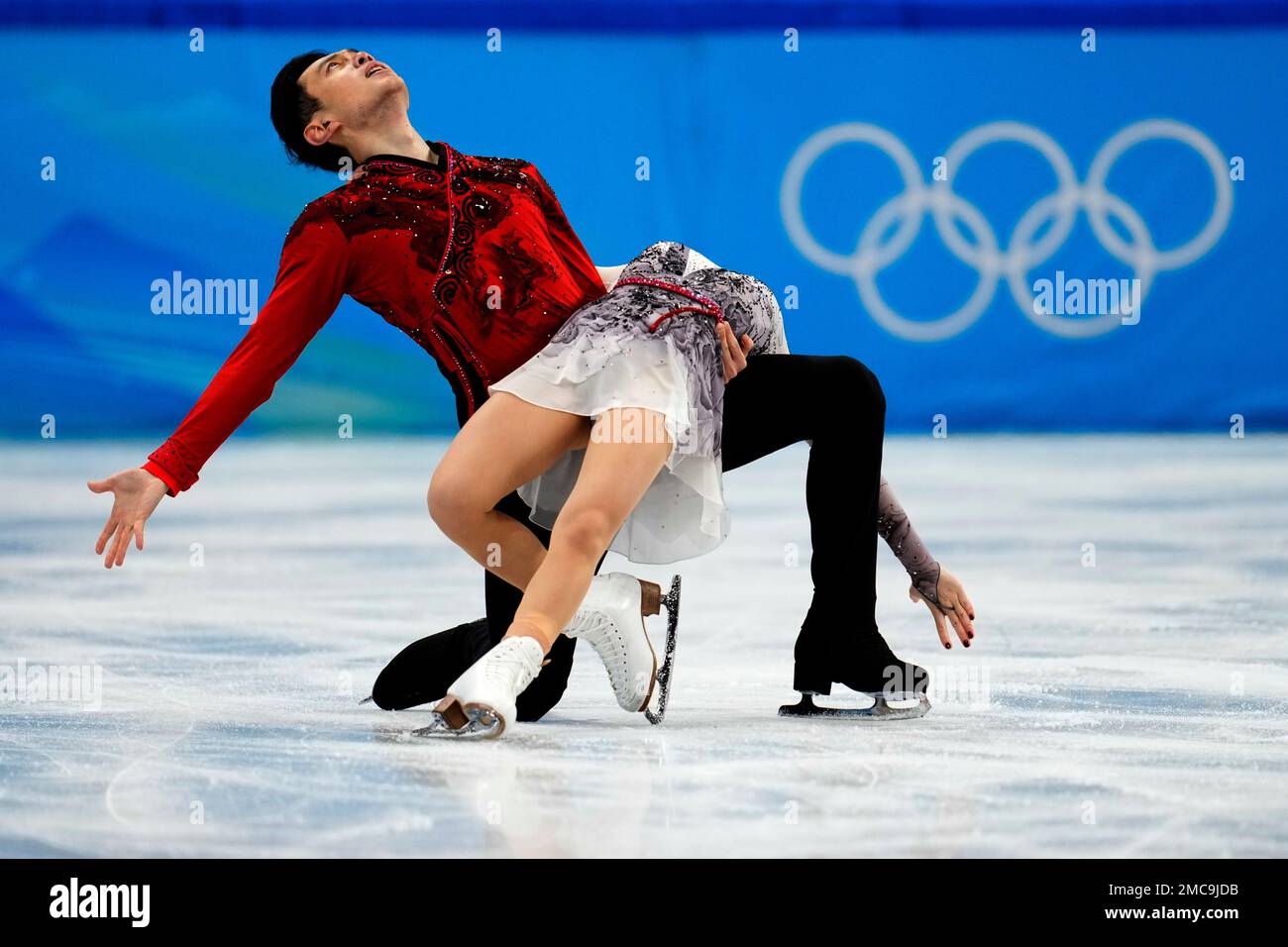 Peng Cheng and Jin Yang, of China, compete in the pairs team free skate ...