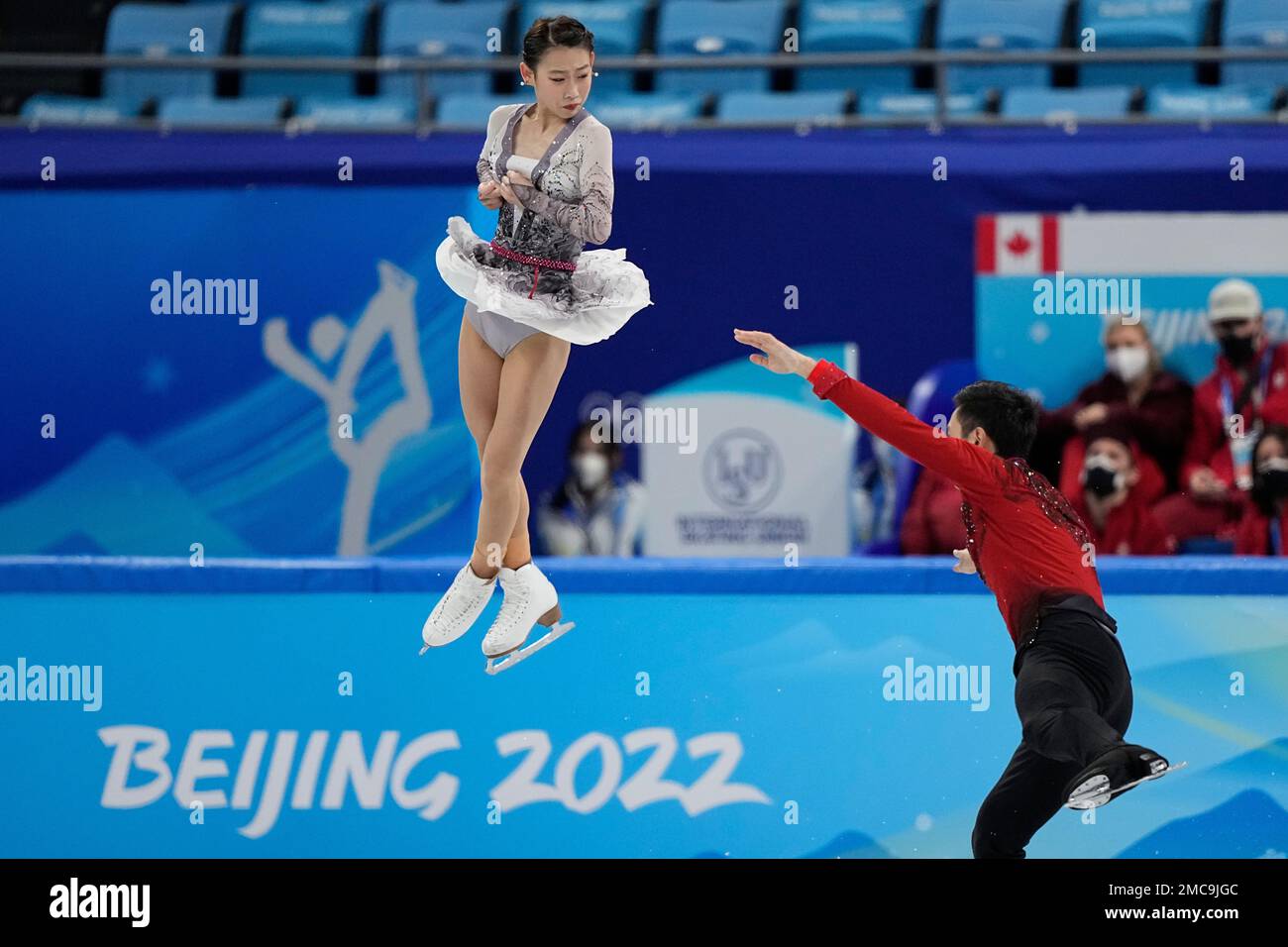 Peng Cheng and Jin Yang, of China, compete in the pairs team free skate ...