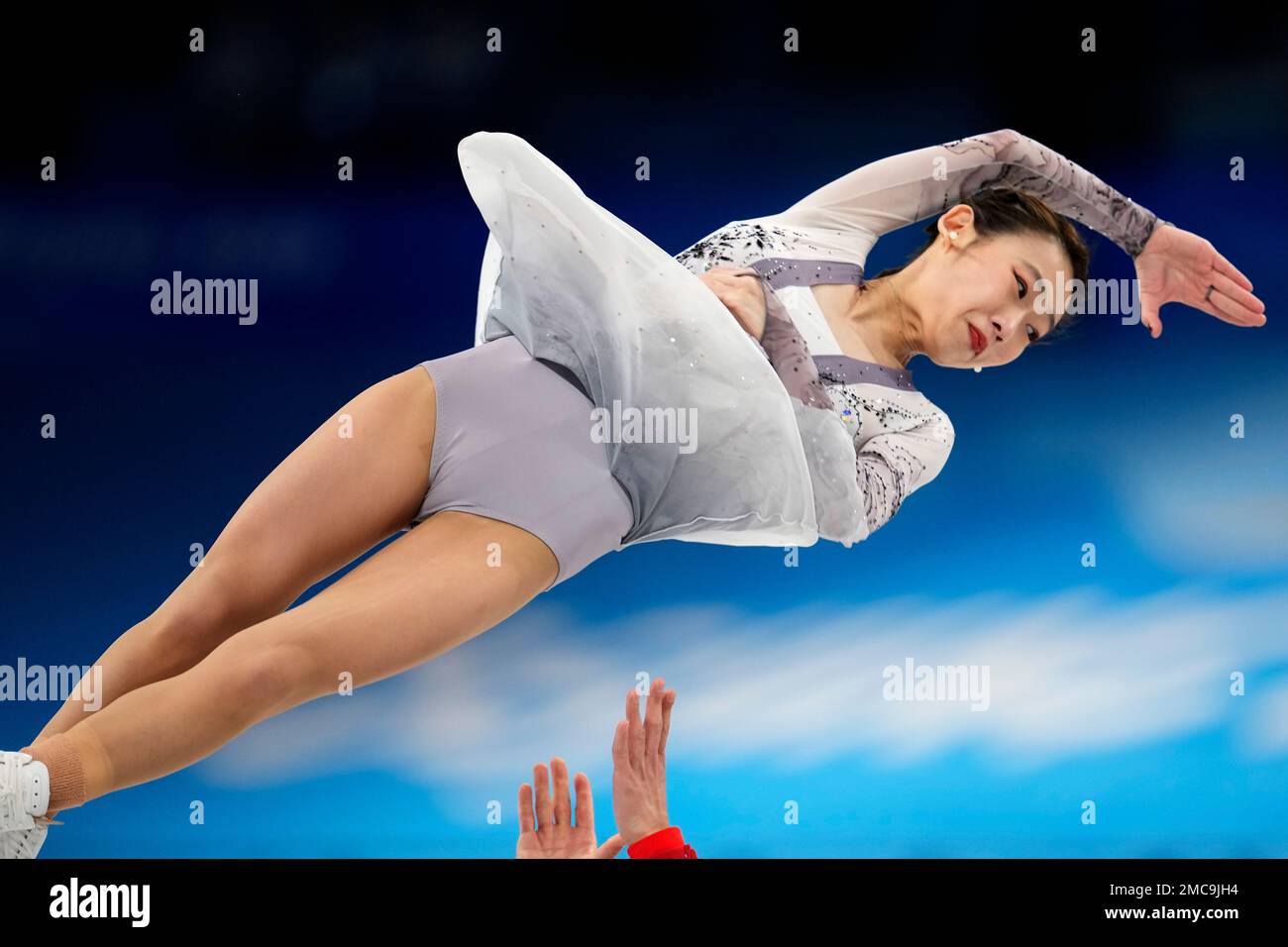 Peng Cheng and Jin Yang, of China, compete in the pairs team free skate ...