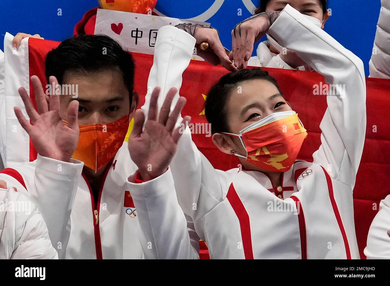Peng Cheng and Jin Yang, of China, react after the pairs team free ...