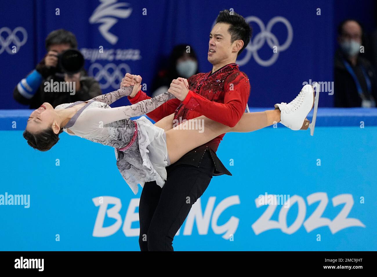Peng Cheng and Jin Yang, of China, compete in the pairs team free skate ...