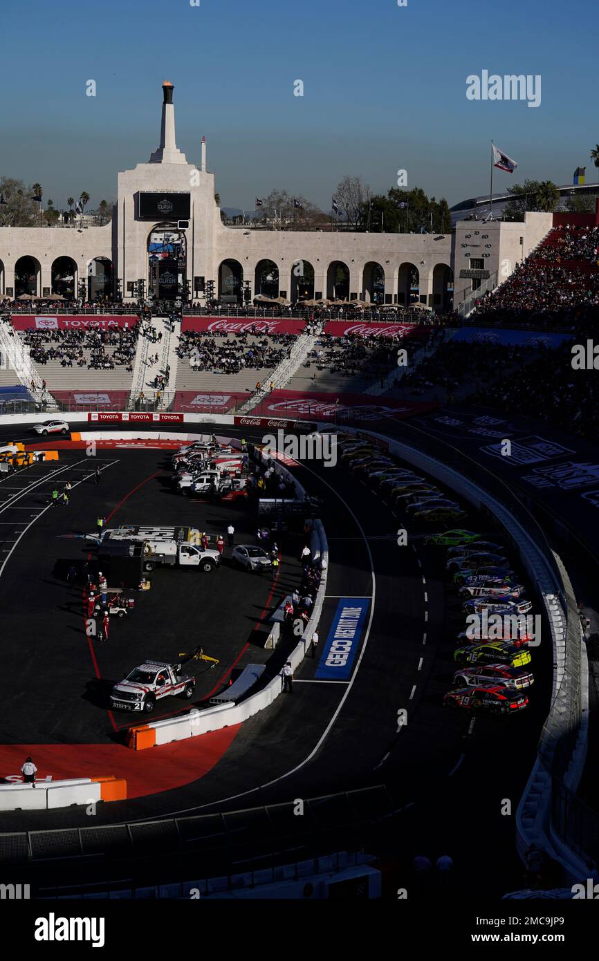 Cars are lined up on the track before a NASCAR exhibition auto race at ...