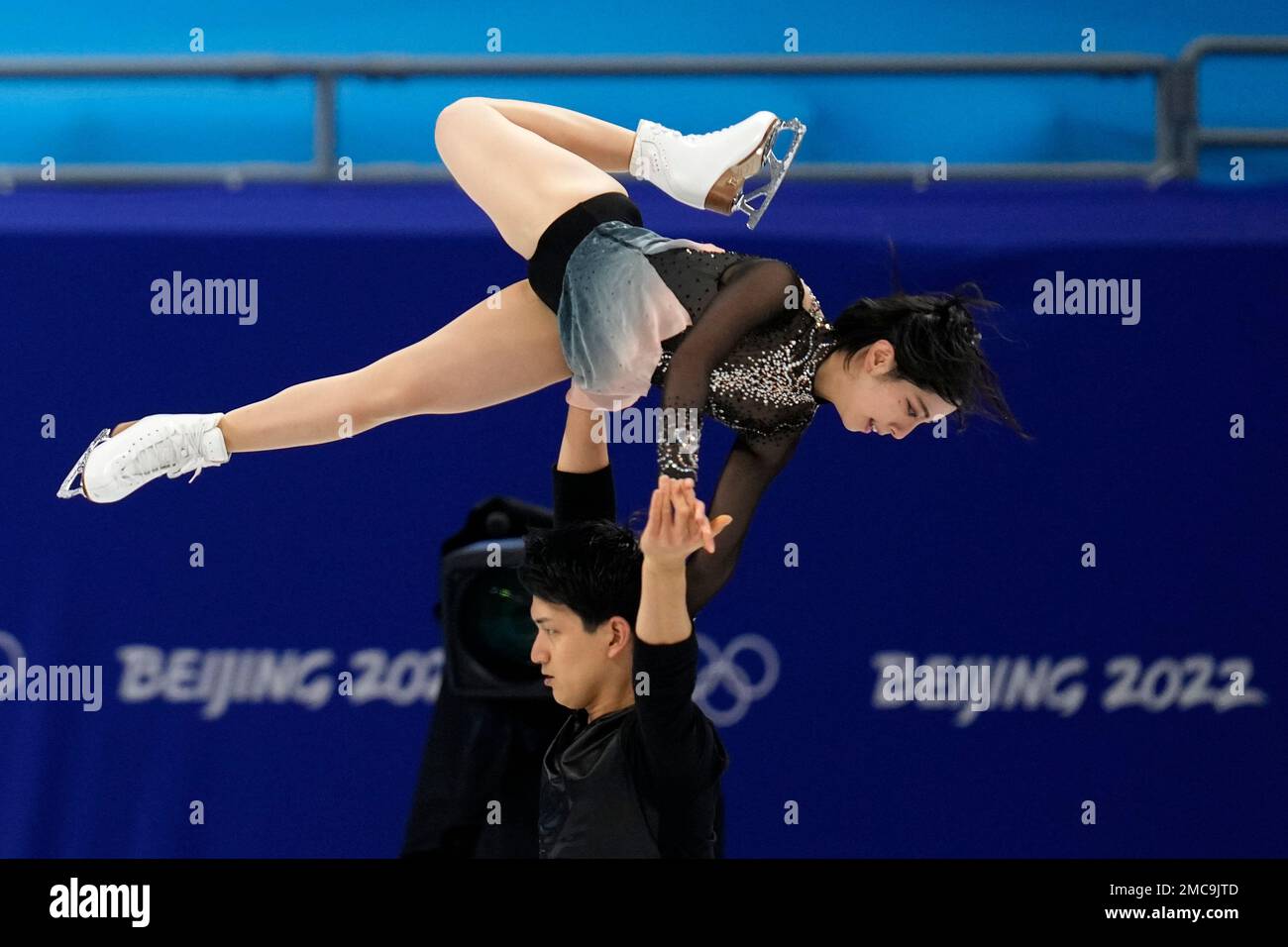 Riku Miura and Ryuichi Kihara, of Japan, compete in the pairs team free ...