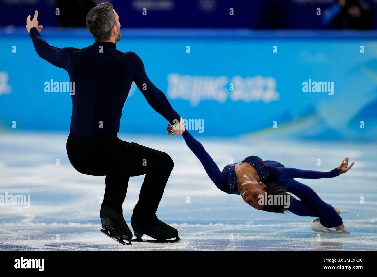 Vanessa James, right, and Eric Radford, of Canada, compete in the pairs ...