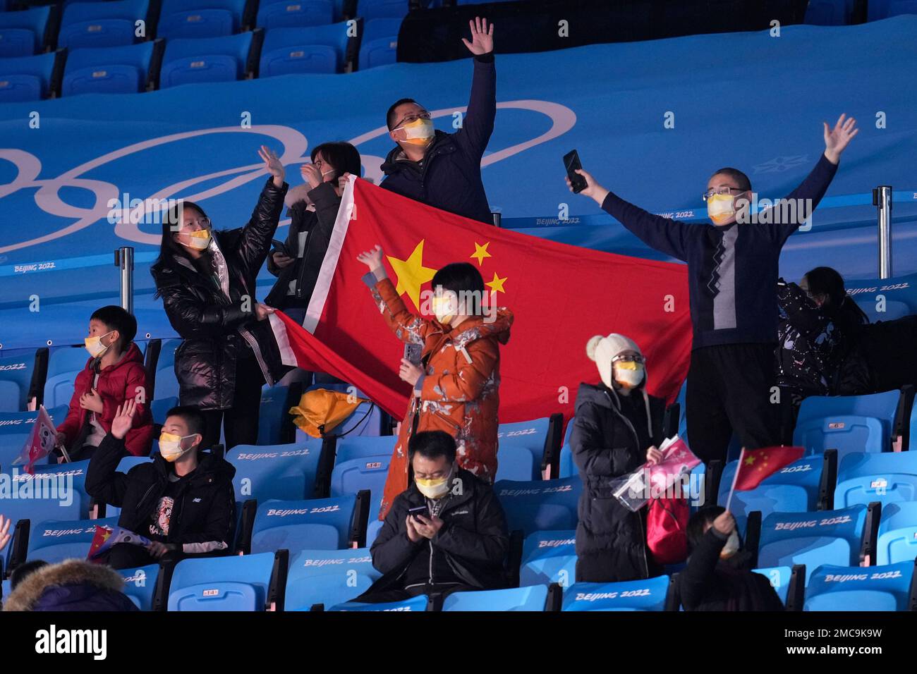 Fans wait for the start of the pairs team free skate program during the ...