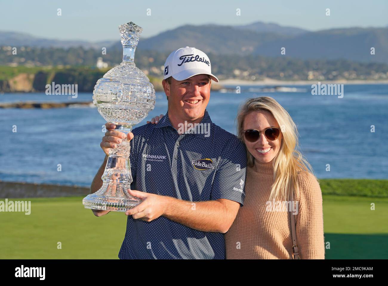 Tom Hoge, left, poses with his trophy and his wife, Kelly, on the 18th ...