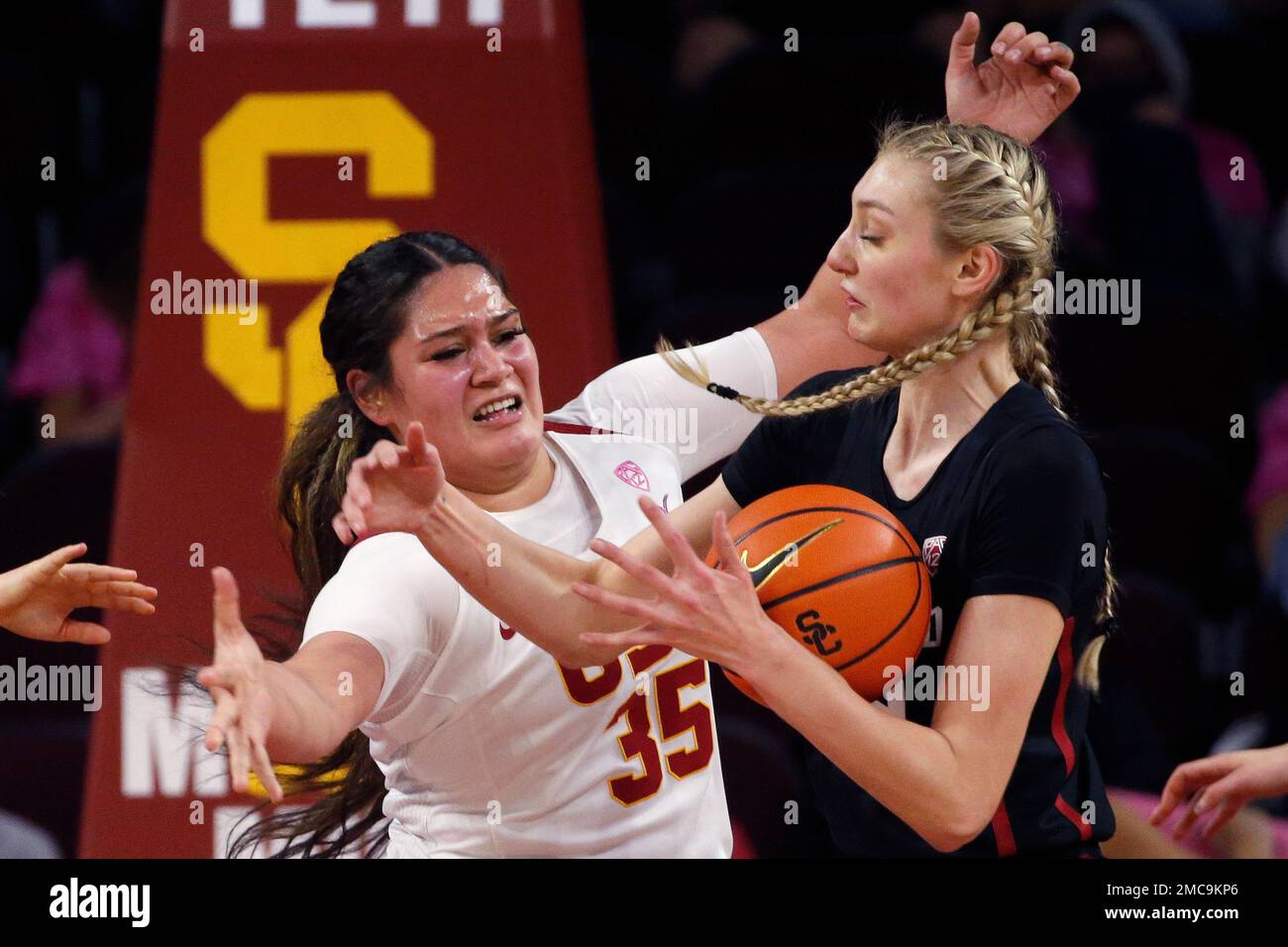 Stanford forward Cameron Brink, right, struggles to the ball while ...