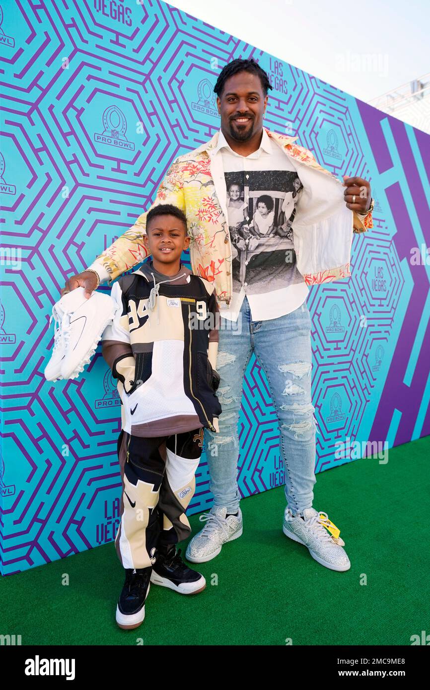 Cam Jordan, right, and son Caleb Tank arrive for the 2022 Pro Bowl on ...