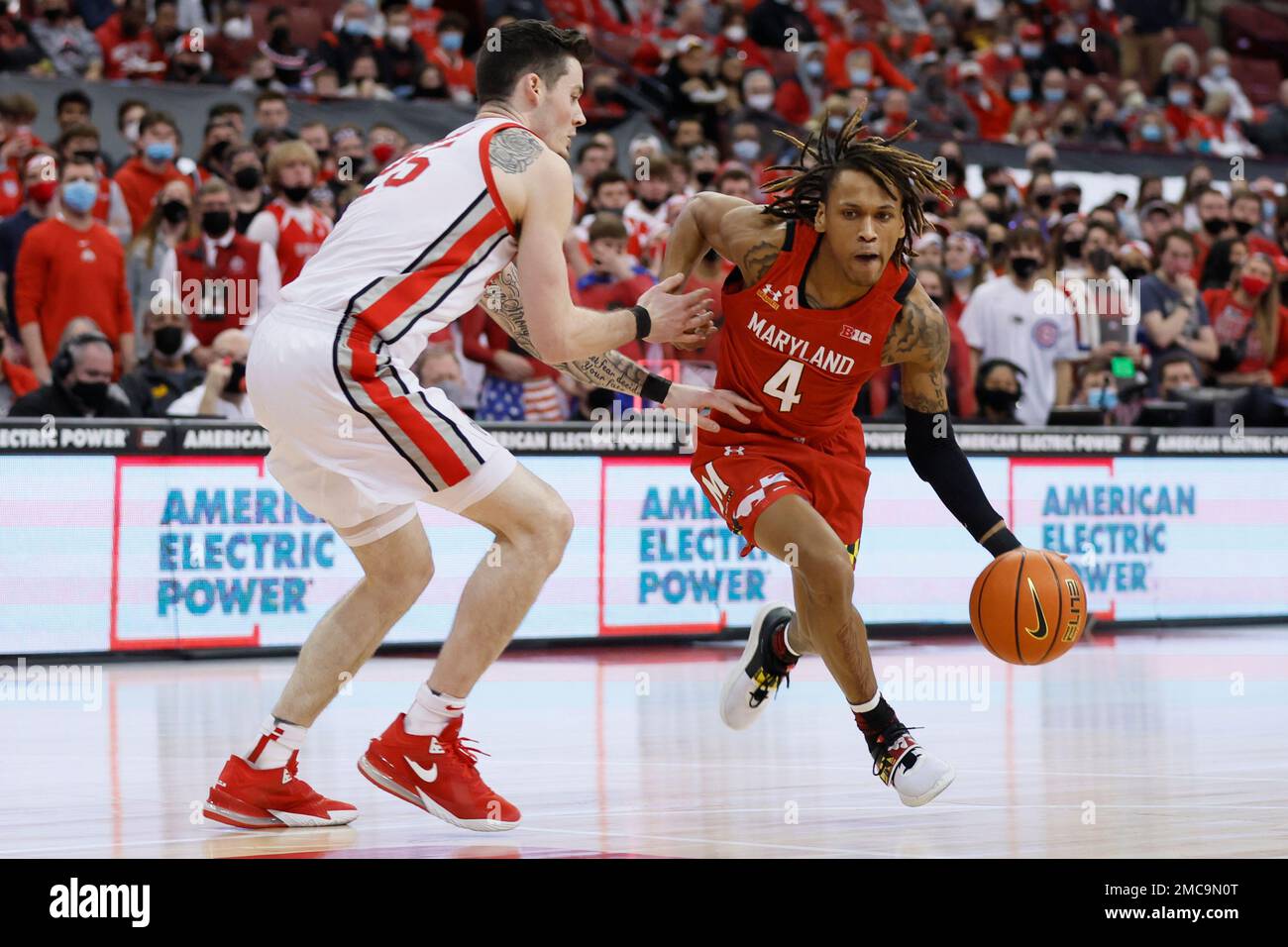 Maryland's Fatts Russell, right, drives to the basket against Ohio ...