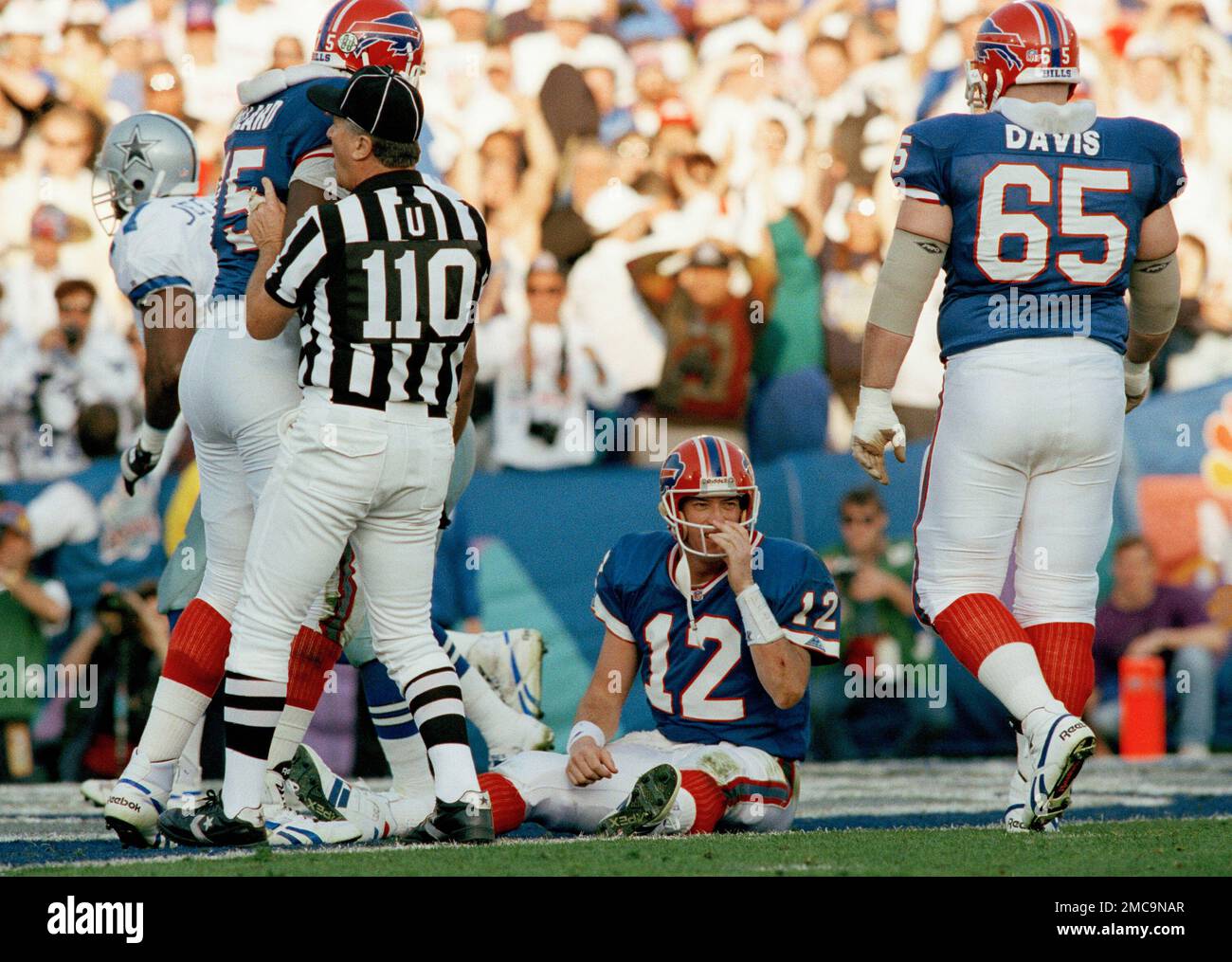 FILE - Buffalo Bills quarterback Jim Kelly (12) sits on the field after ...