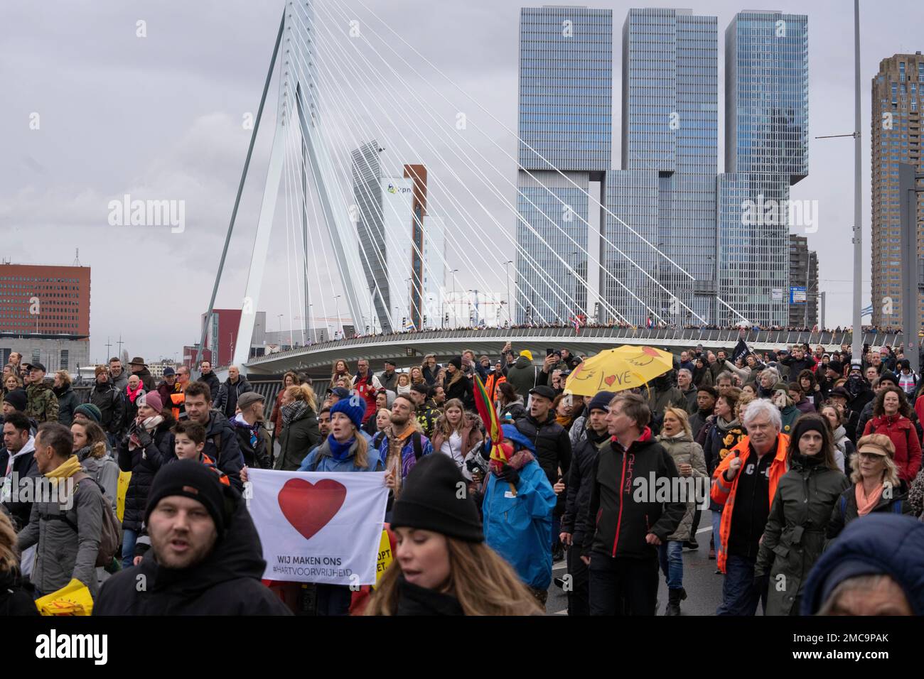Thousands of people pass over Erasmus bridge as they marched to protest ...
