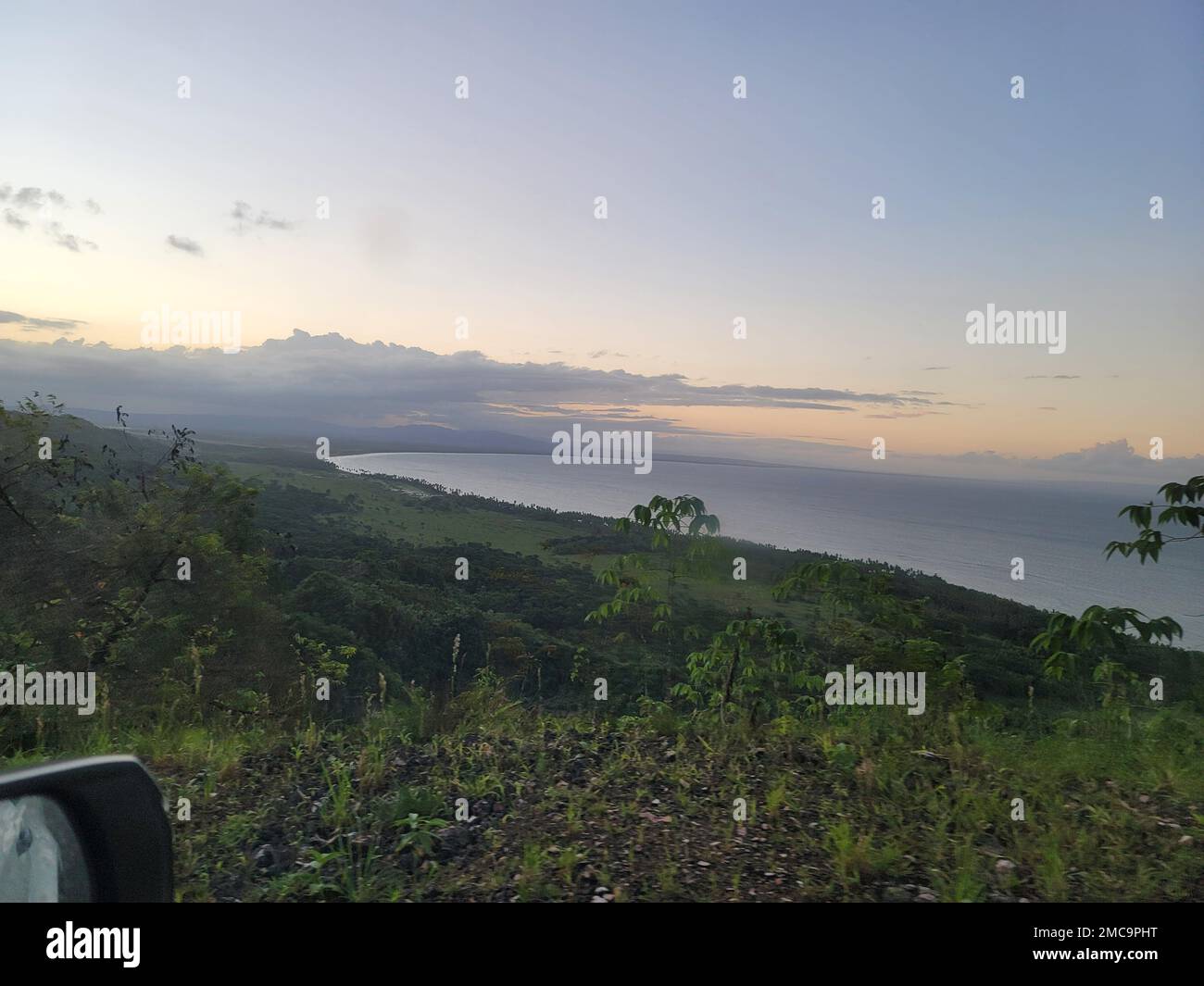 A scenic view of a beautiful sunset landscape over the seascape in ...