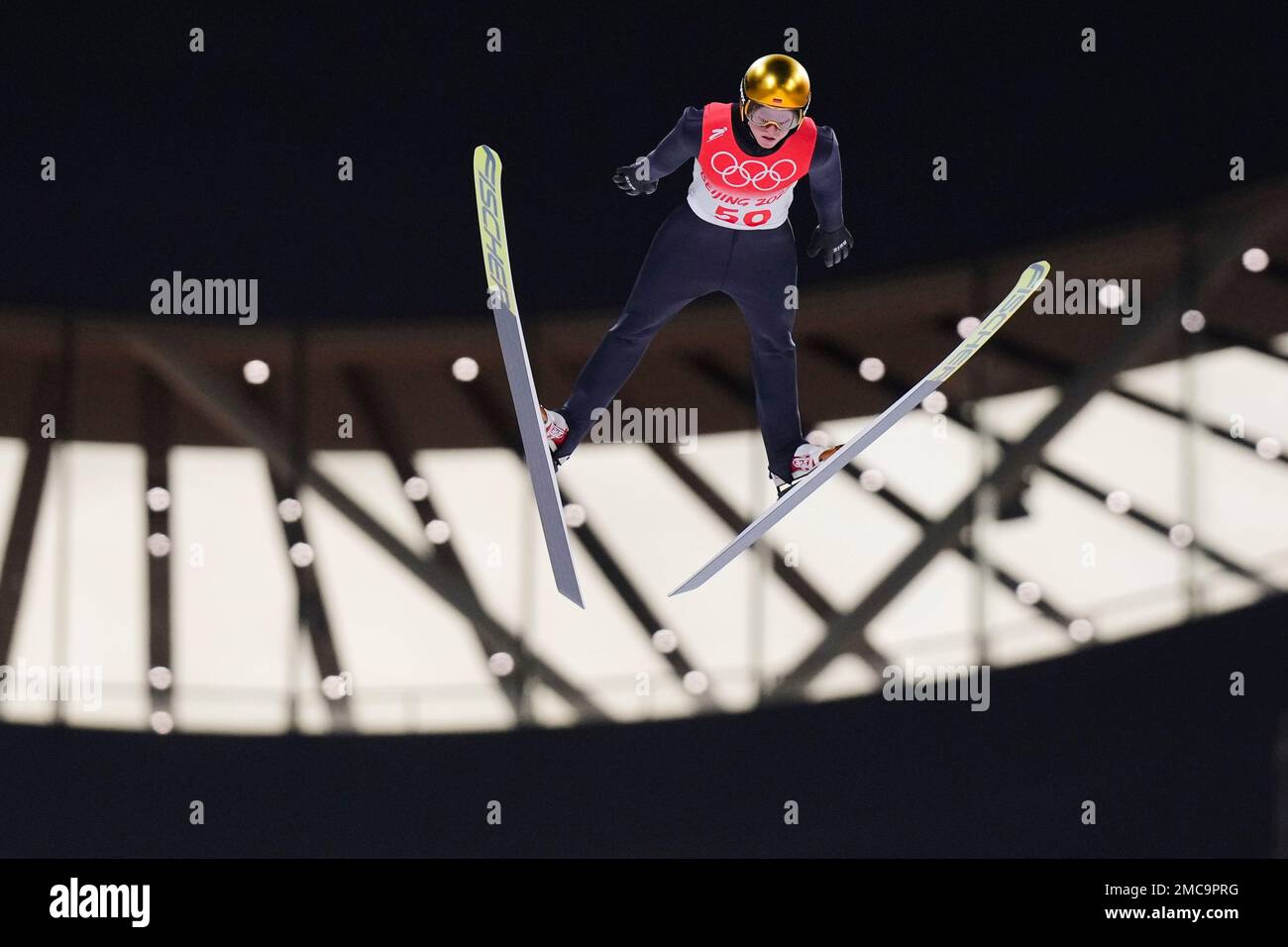 Karl Geiger, of Germany, soars through the air during the men's normal ...