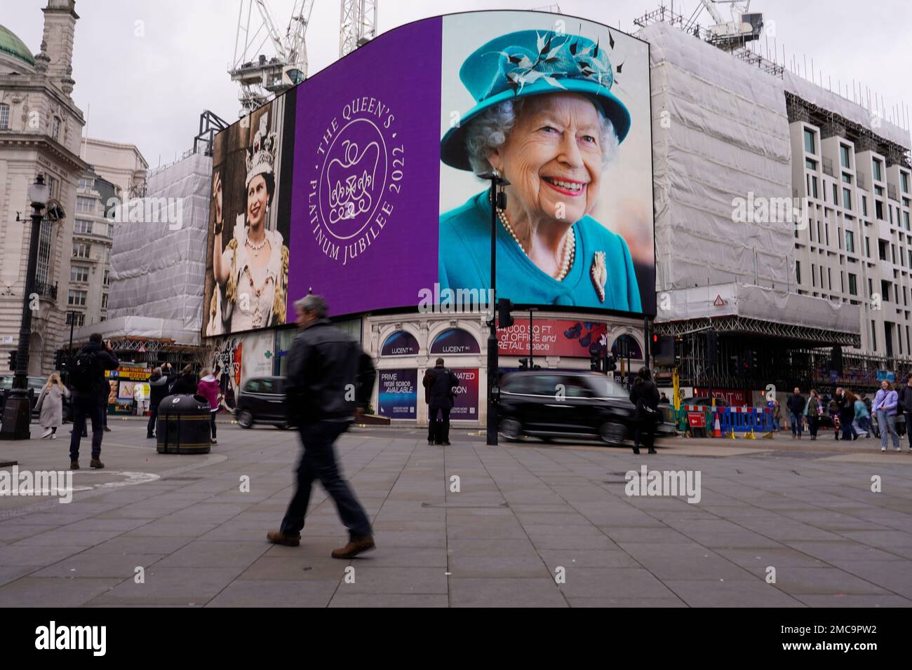 The screen in Piccadilly Circus is lit to celebrate the 70th ...