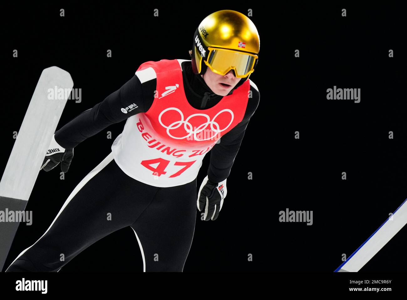 Marius Lindvik, of Norway, soars through the air during the men's ...