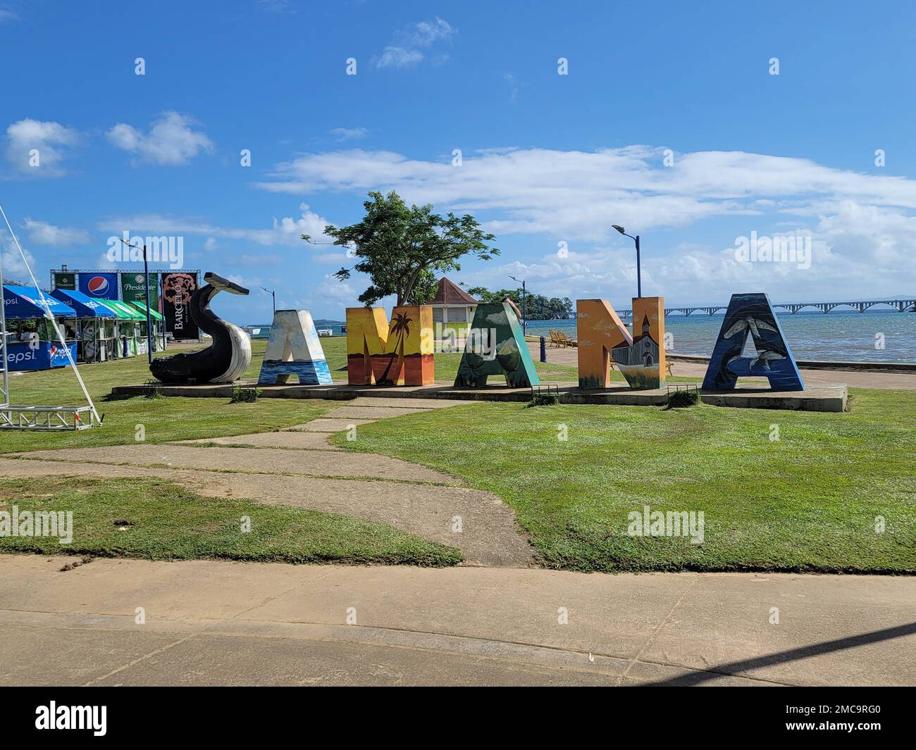 A scenic view of a beach with Samana colorful letters in summer in blue ...