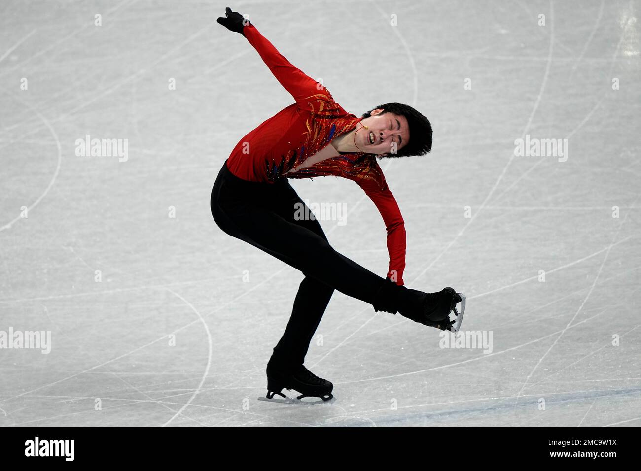 Jin Boyang, of China, competes in the men's team free skate program ...