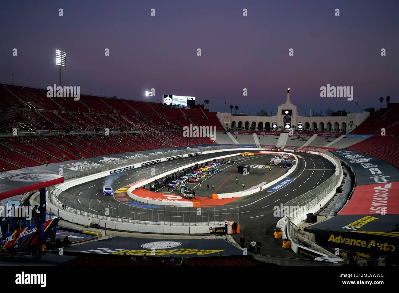 Drivers participate in a qualifying session at Los Angeles Memorial ...