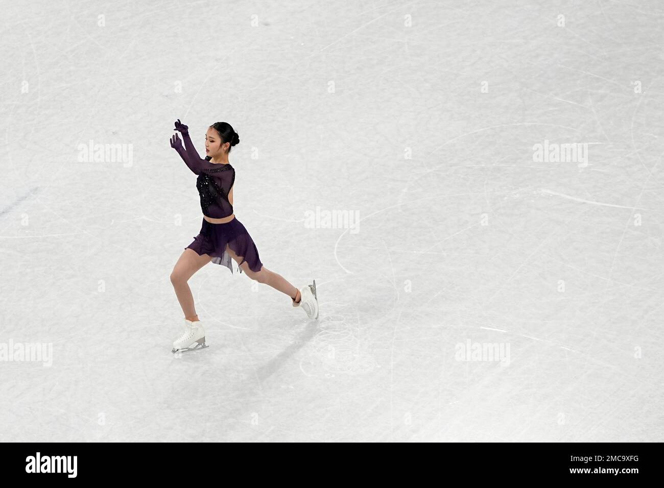 Zhu Yi, of China, competes in the women's short program team figure ...
