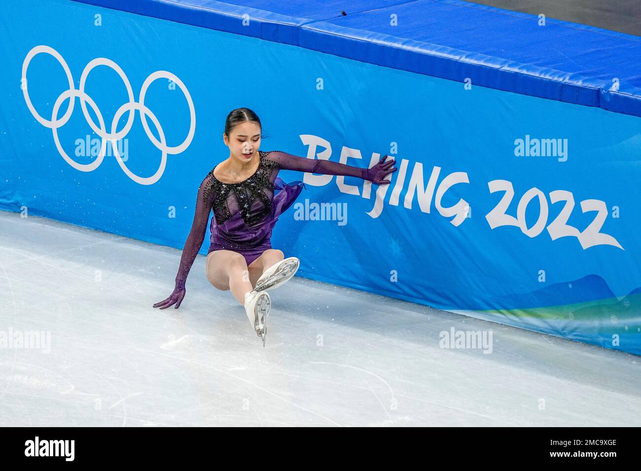 Zhu Yi, of China, falls in the women's short program team figure ...