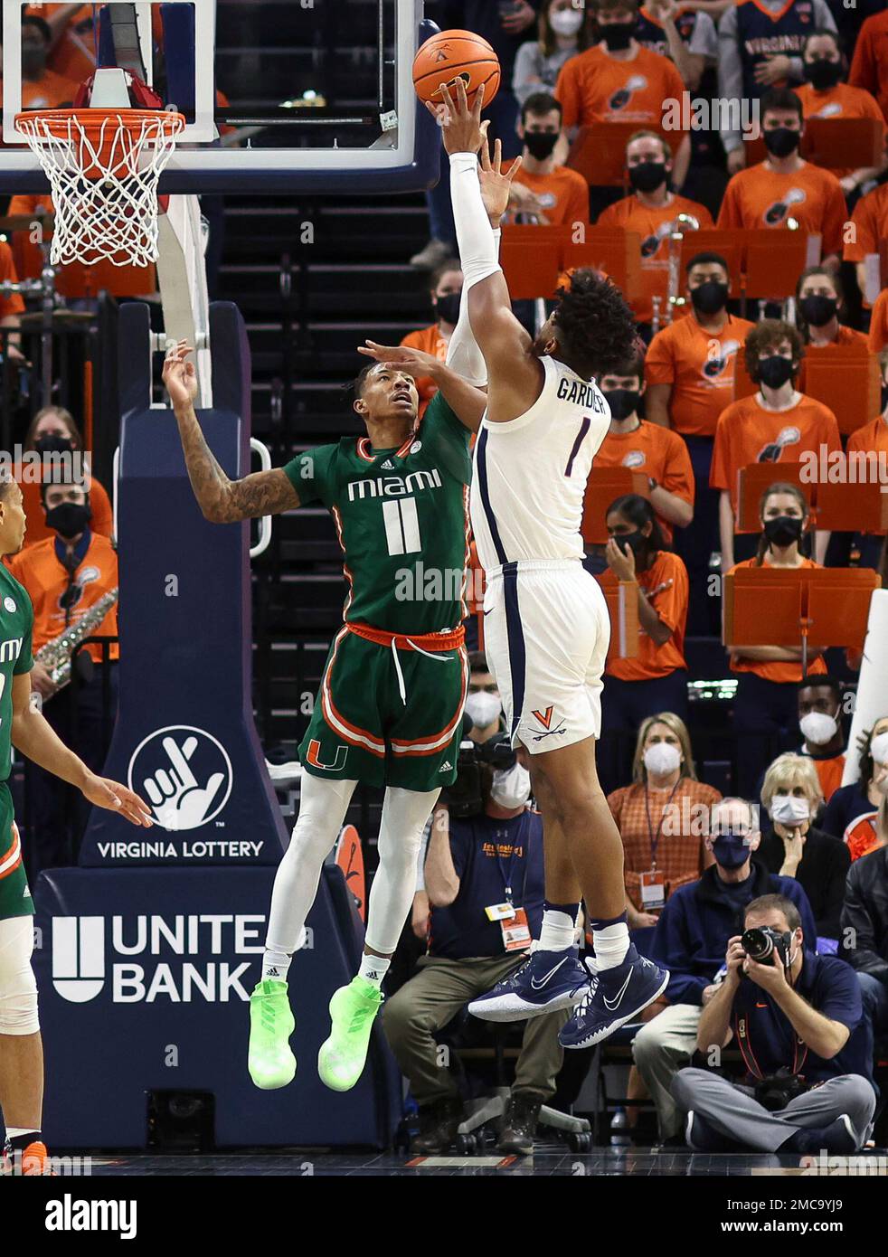 Virginia forward Jayden Gardner (1) shoots over Miami guard Jordan ...