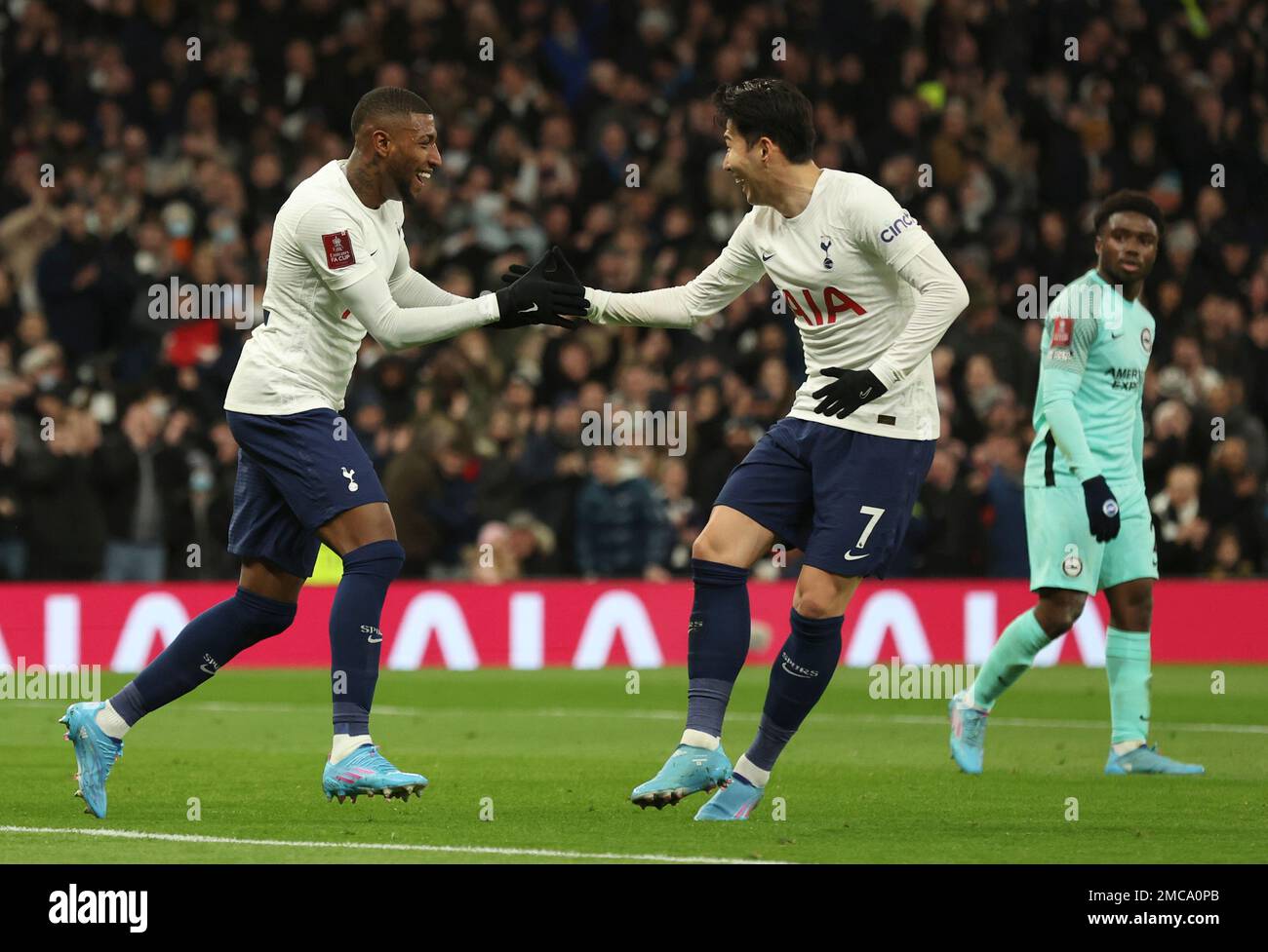Tottenham Hotspur's Emerson Royal, left, celebrates after Brighton and ...