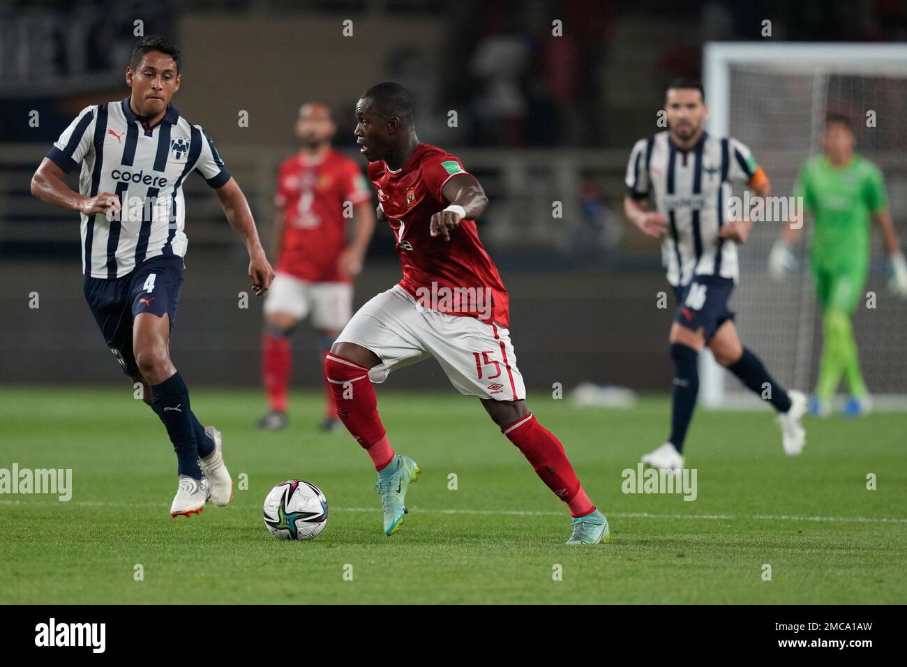 Monterrey's Luis Romo, left, and Dieng Aliou of Al Ahly run for the ...