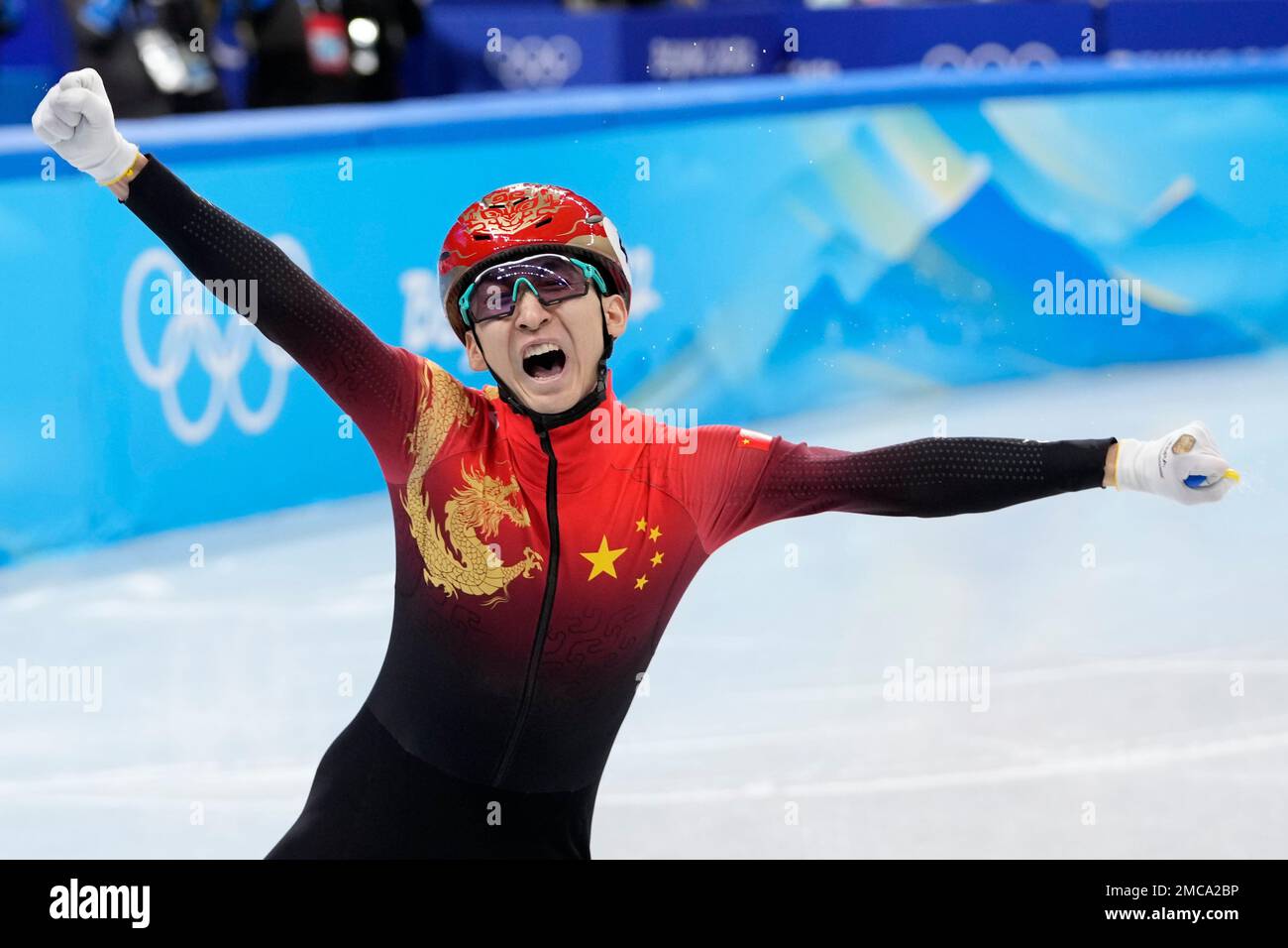 Wu Dajing of China celebrates after crossing the finish line to win the ...