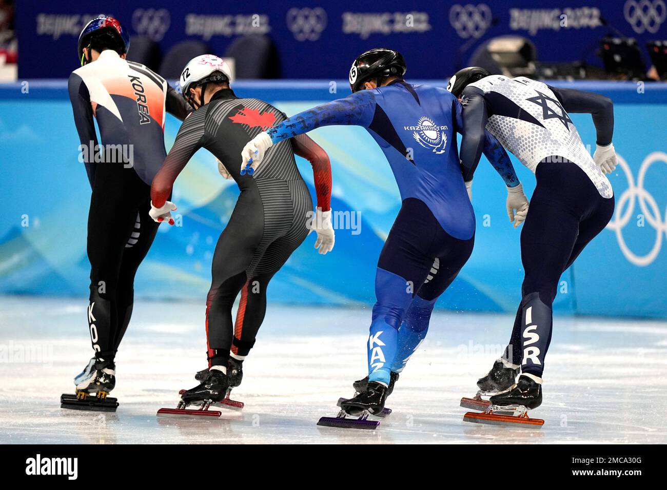 Lee Juneseo, left, of South Korea, wins his heat of the men's 1,000 ...