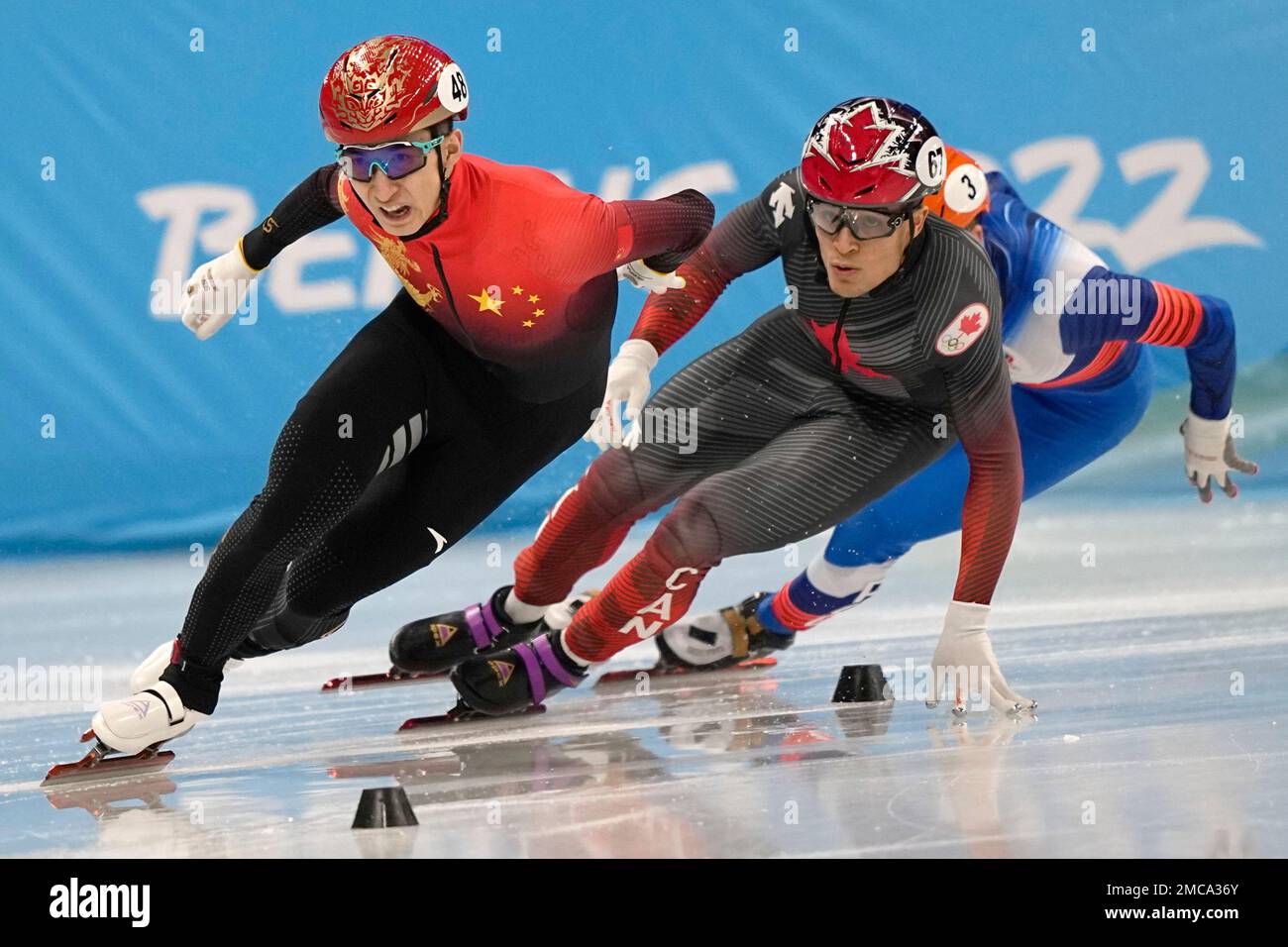 Wu Dajing of China, left, leads the field in his heat of the men's ...
