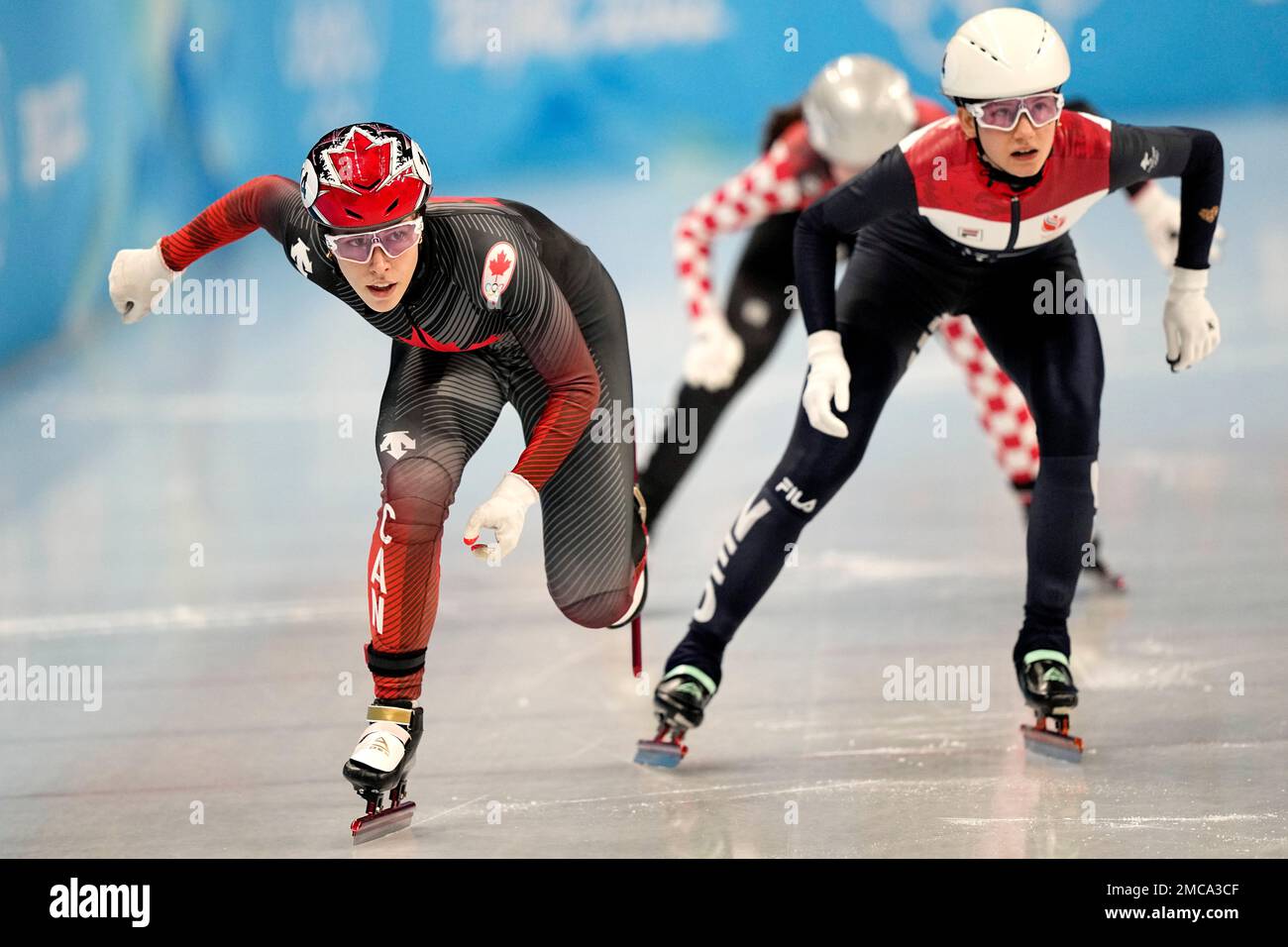 Florence Brunelle of Canada, left, races in her heat of the women's 500 ...