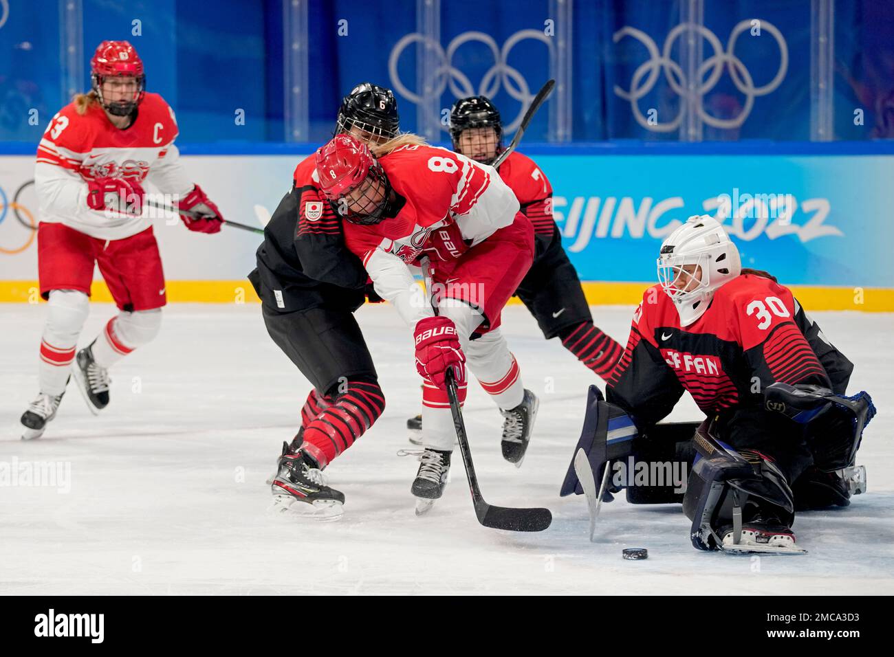 Denmark's Josefine Persson (8) shoots against Japan goalkeeper Akane ...