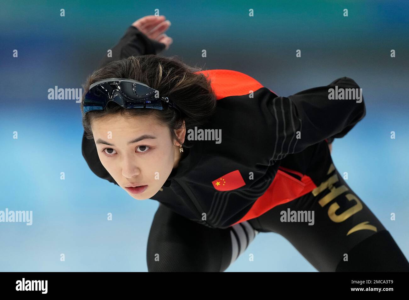 Ahenaer Adake of China warms up before her heat in the women's ...