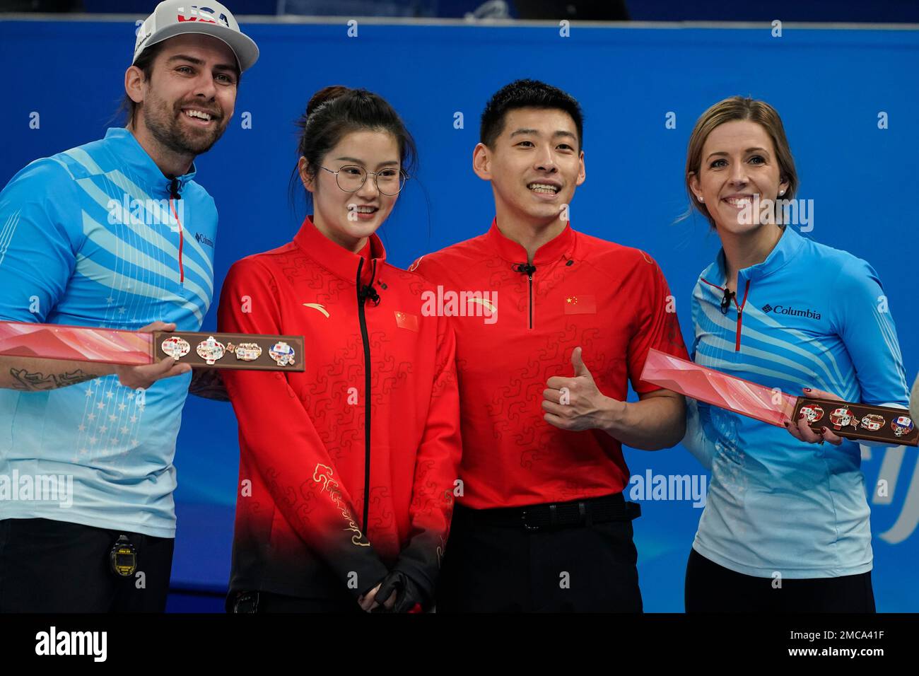 Fan Suyuan, center left, and Ling Zhi, center right, both of China ...