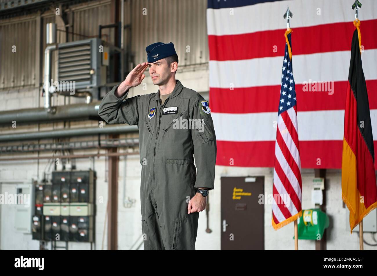 Col. Thomas Graham, 52nd Operations Group commander, renders the first ...