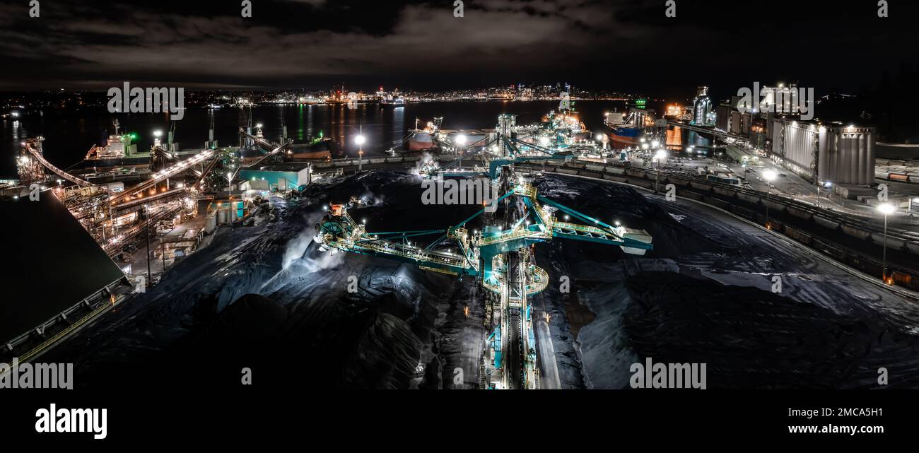 Rotary shovel at coal pile, bulk shipping terminal, silos, grain ...