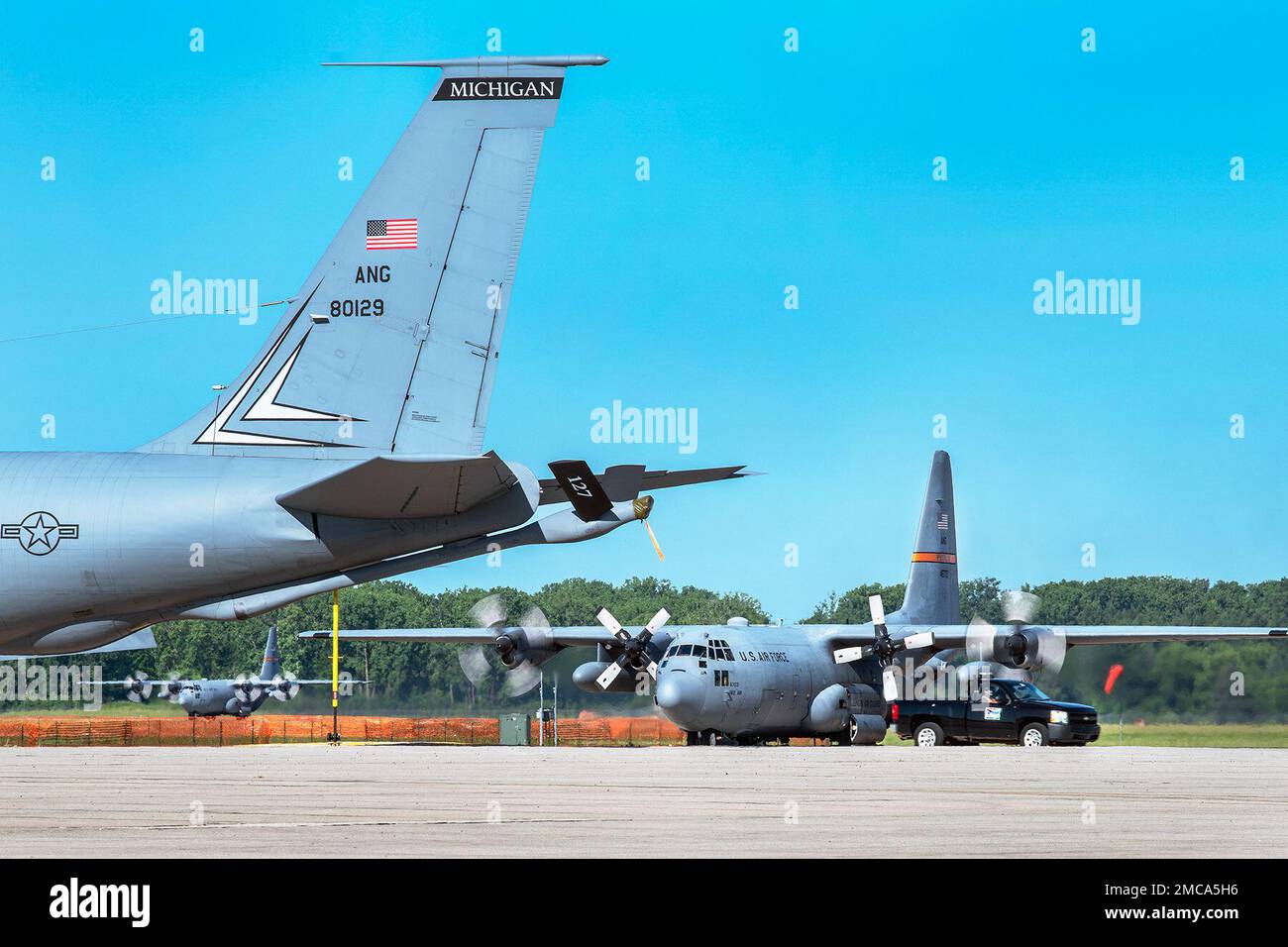 Two C-130 Hercules aircraft from the 182nd Airlift Wing are brought in ...