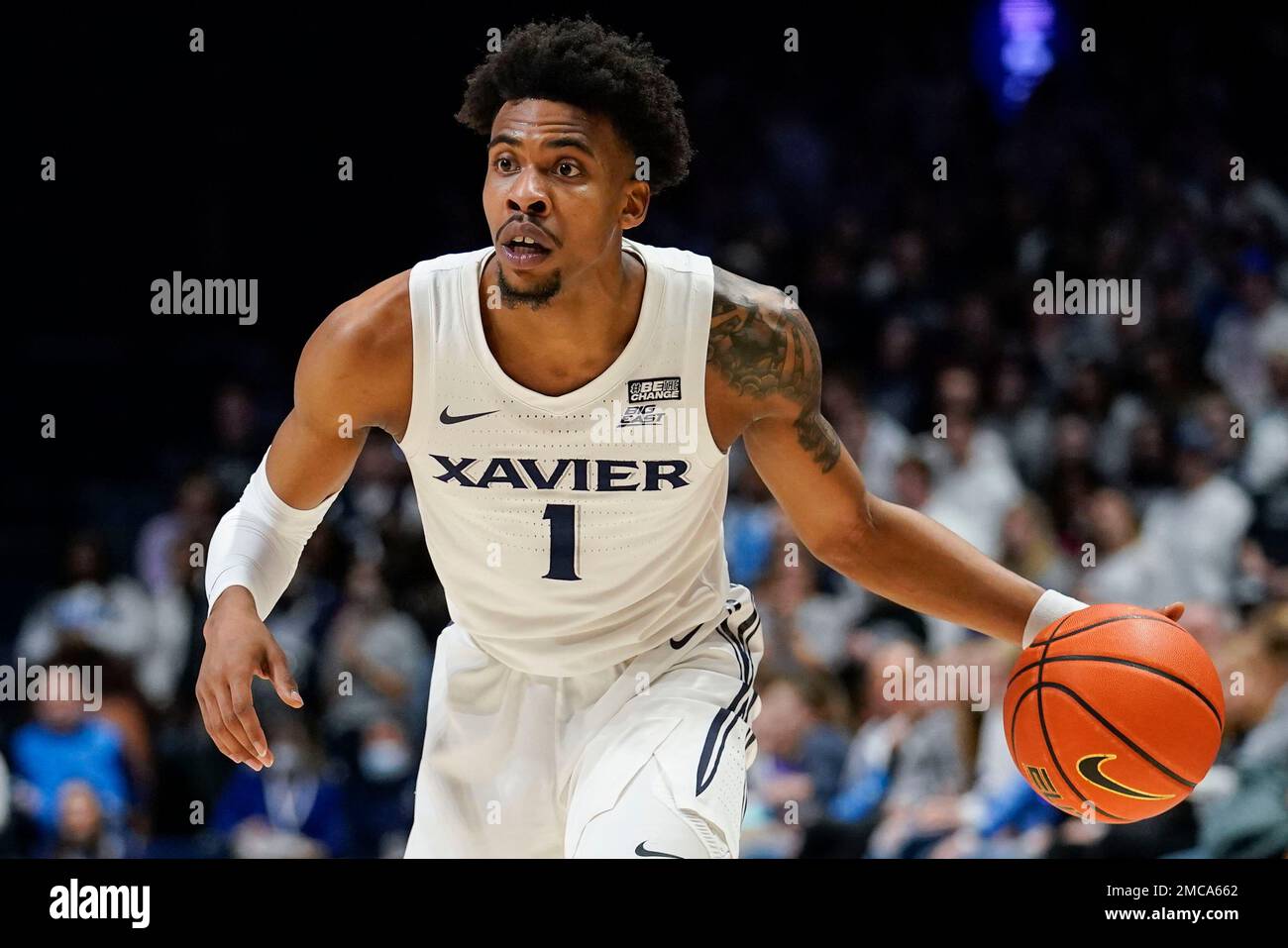 Xavier guard Paul Scruggs (1) dribbles during the second half of an ...
