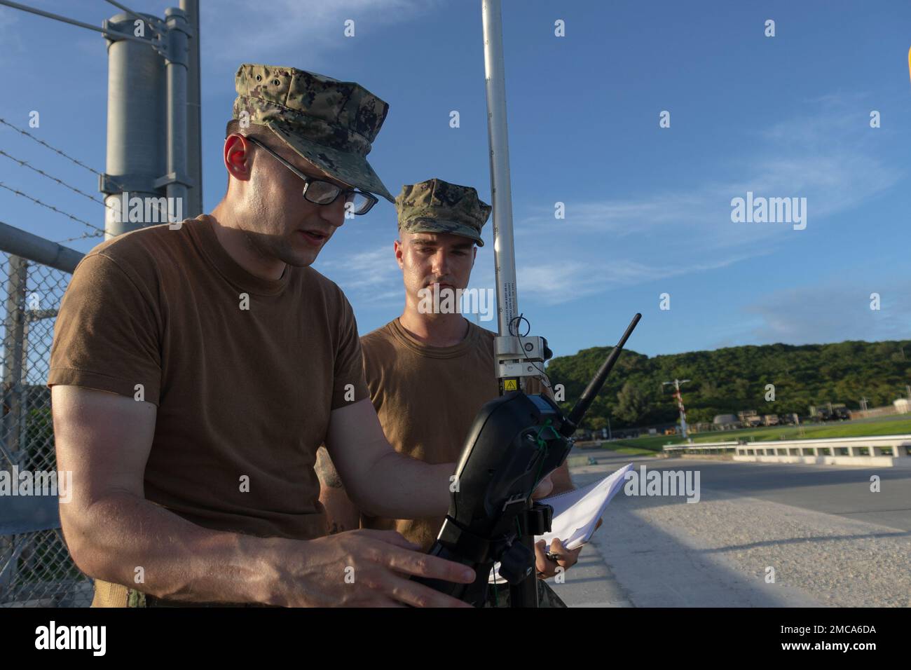 U.S. Navy Engineering Aide 3rd class Sean McNeill, left, and U.S. Navy ...
