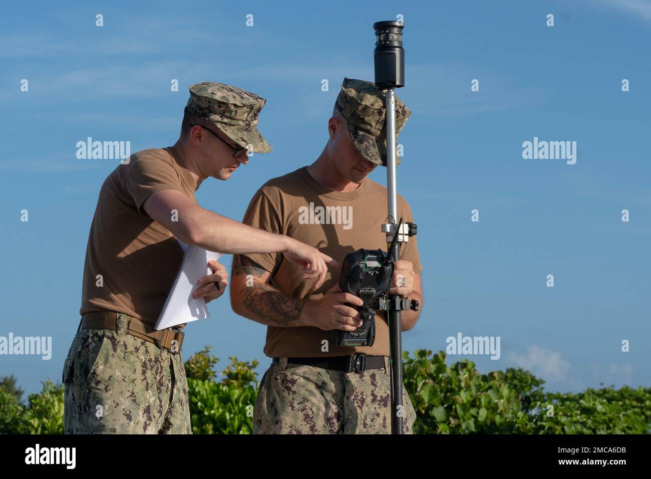 U.S. Navy Engineering Aide 3rd class Sean McNeill, left, and U.S. Navy ...