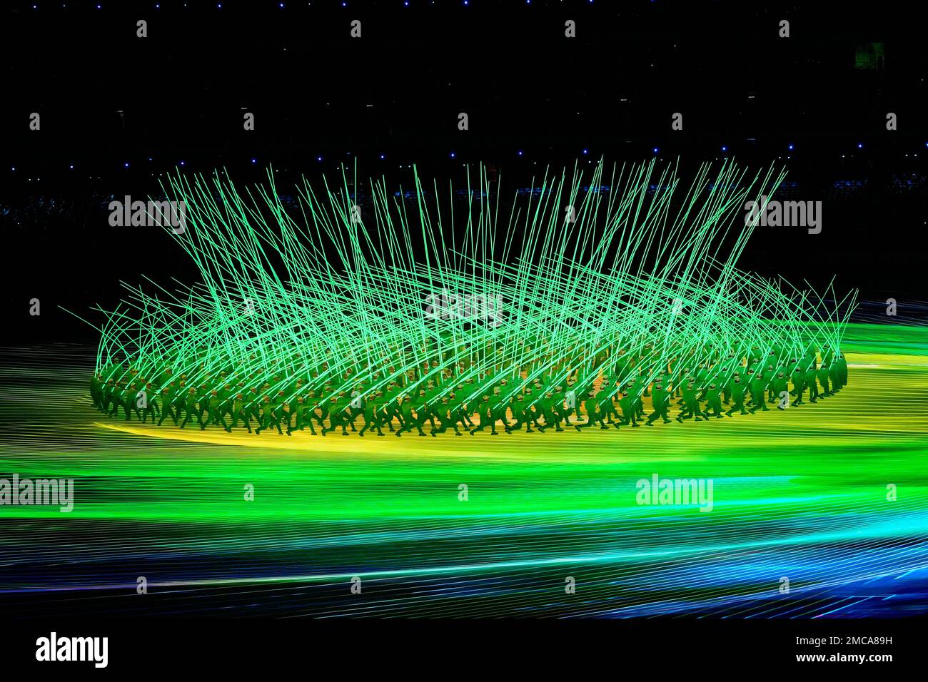 Performers wave light sticks during the opening ceremony of the 2022 ...