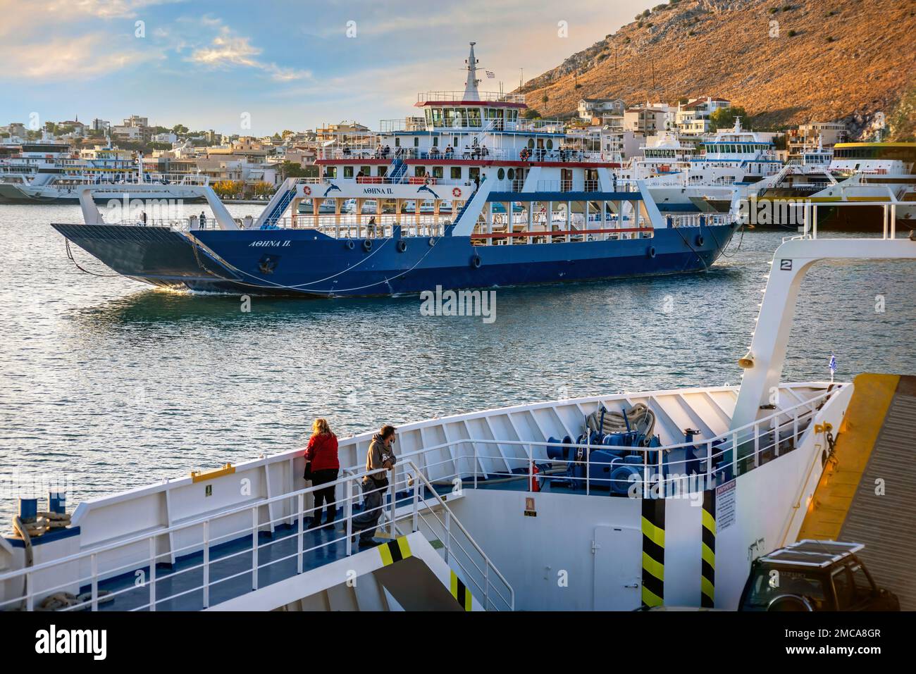 Approaching Salamis port on board a commercial ship at sunset time ...