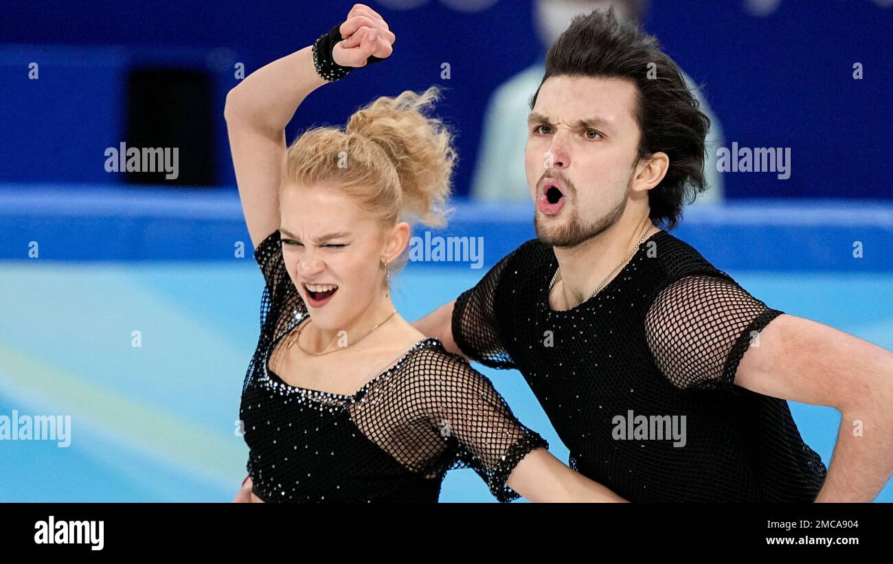 Maria Kazakova, left, and Georgy Reviya, of Georgia, compete during the ...