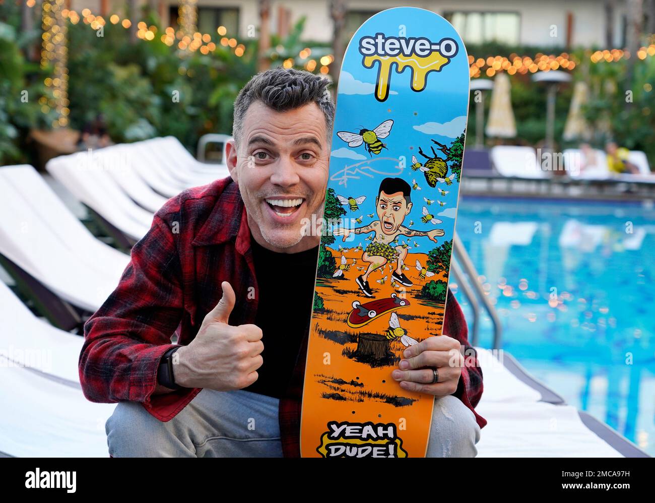 Steve-O, a cast member in the film "Jackass Forever," holds u his ...