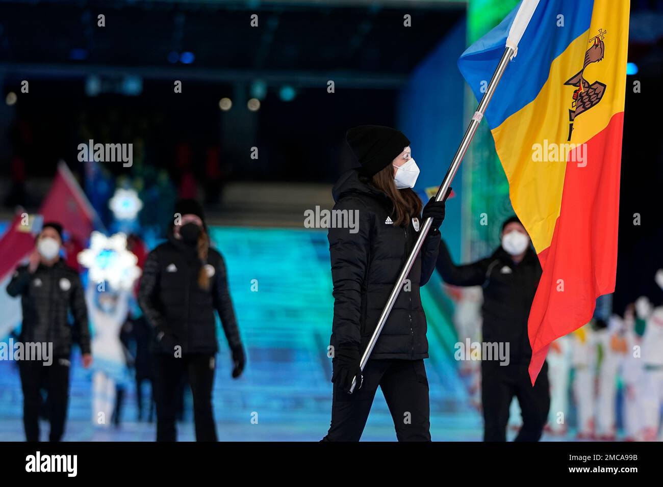 Doina Descalui, of Moldova, carries her national flag into the stadium ...