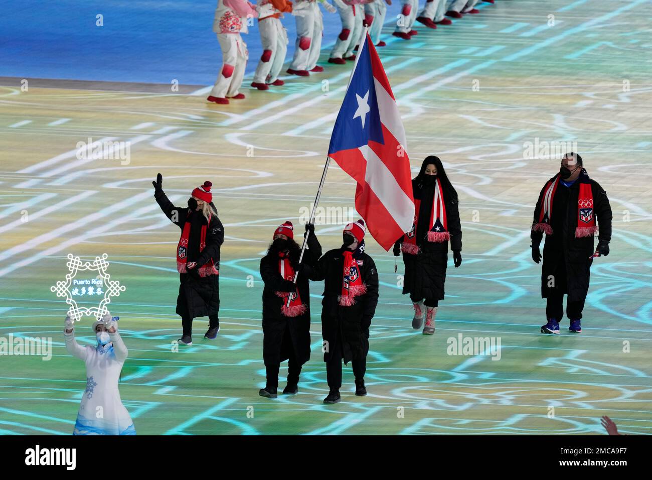 Kellie Delka and William C. Flaherty, of Puerto Rico, carry their ...