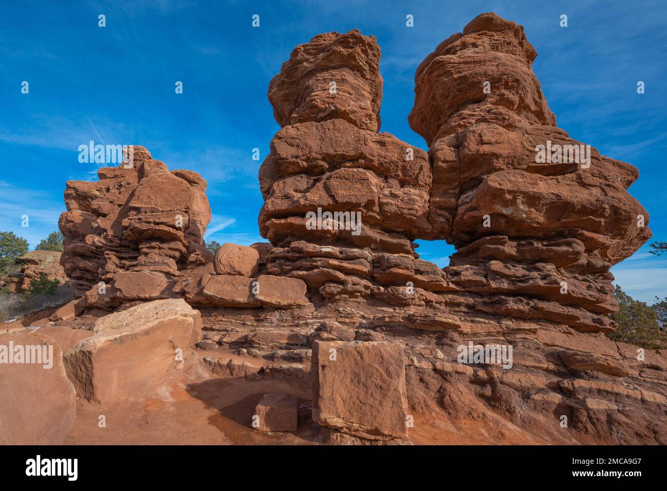 Two red rock sandstone pinnacles with a natural window eroded into ...