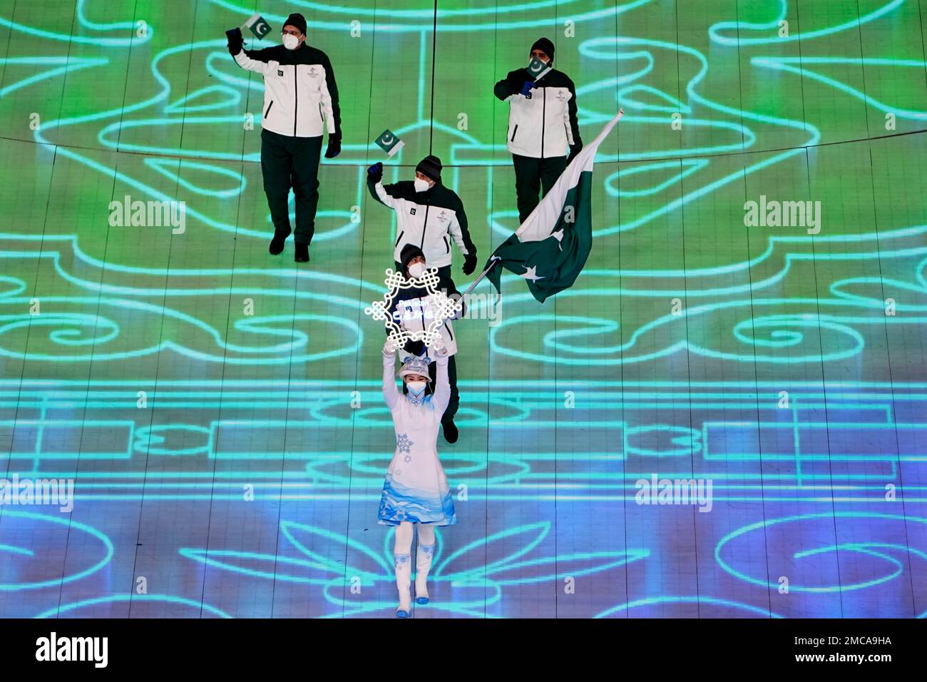 Muhammad Karim, of Pakistan, leads his team in during the opening ...