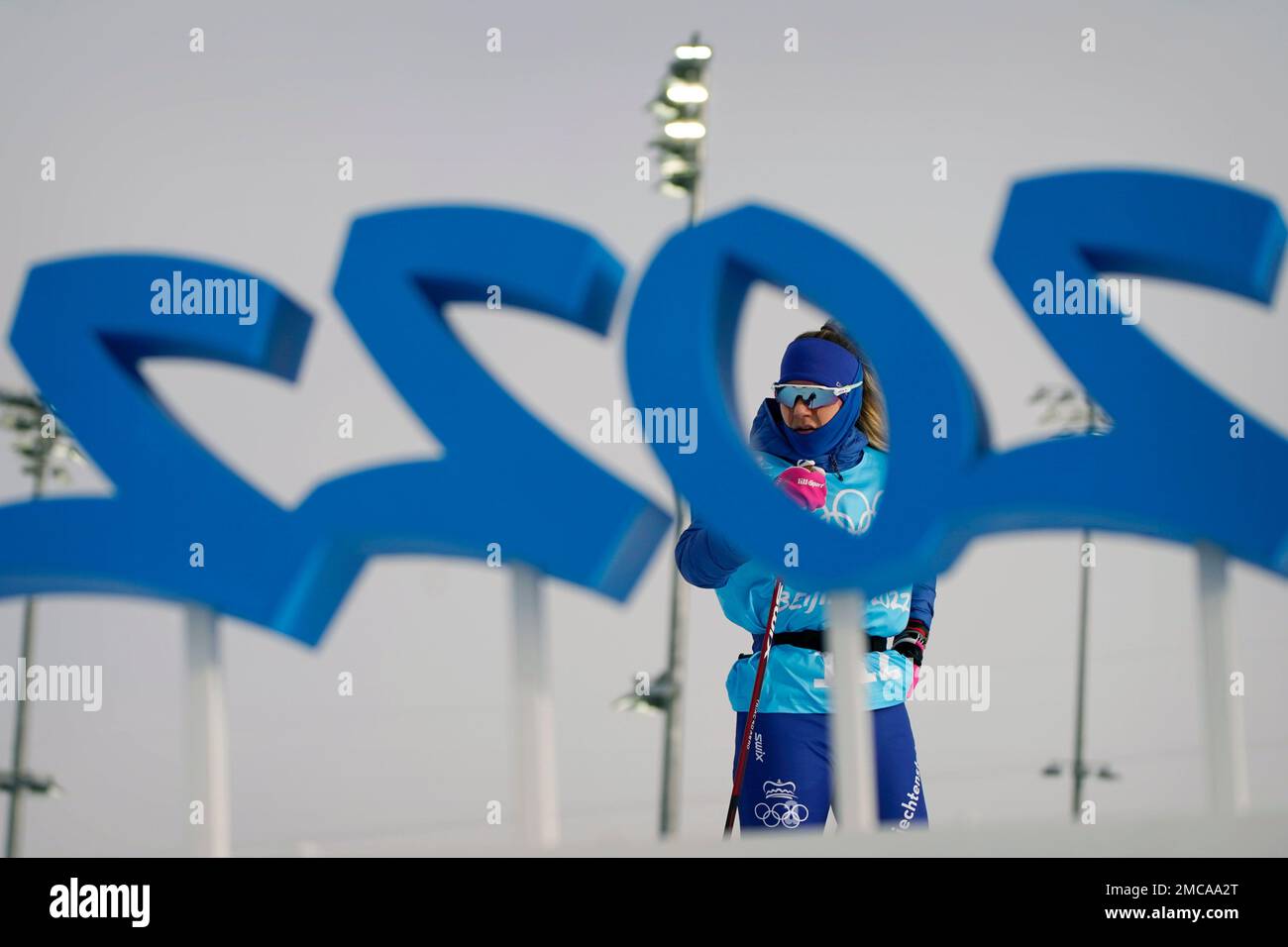 A skier takes a break during a cross-country skiing training session ...