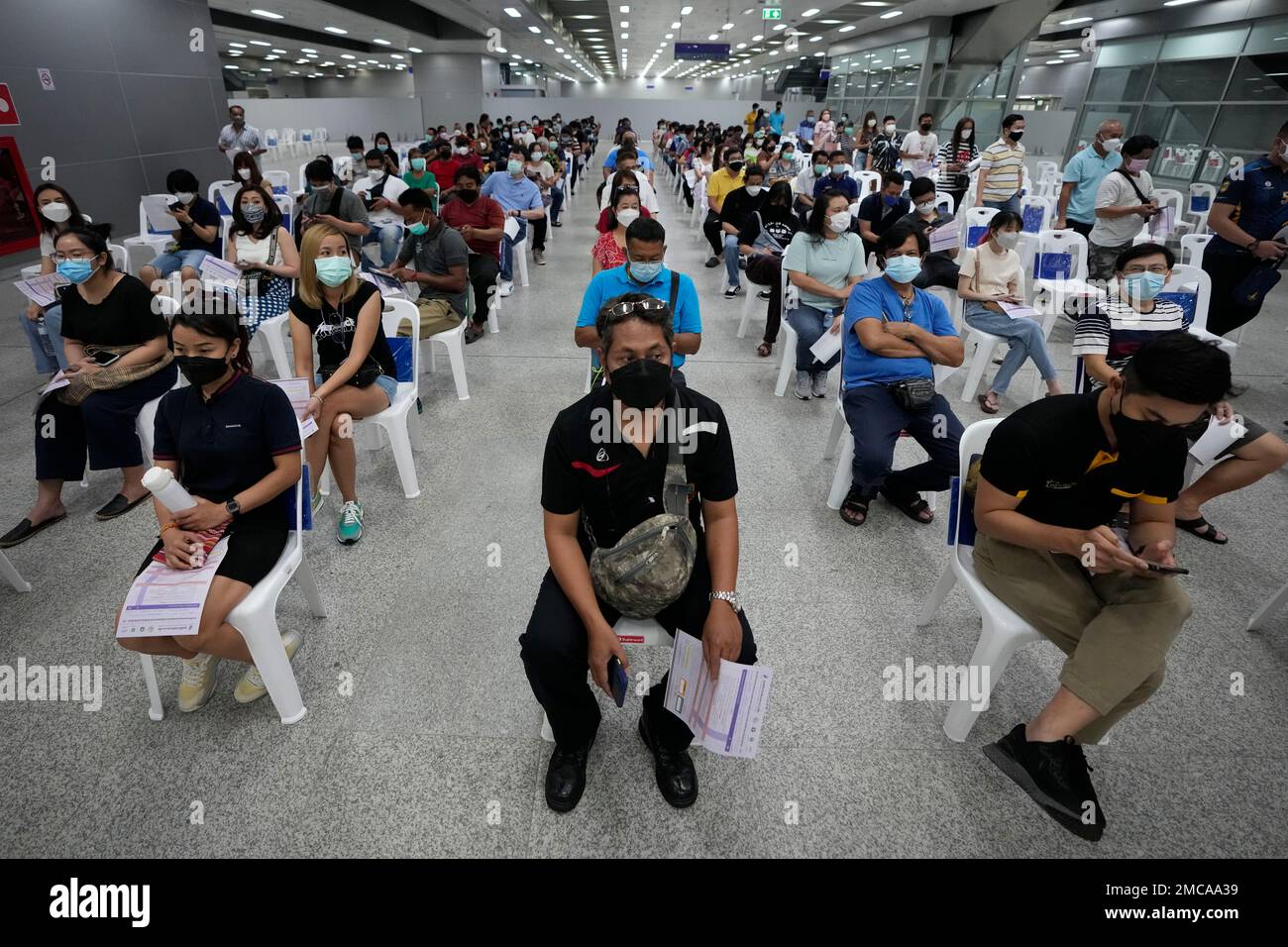 Local residents wait to receive shots of the Pfizer vaccine at the ...